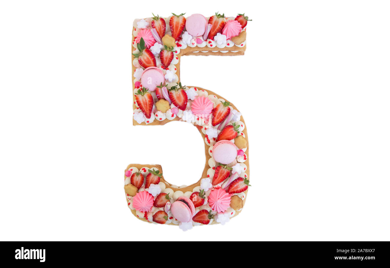 beautiful homemade birthday cake in the form of the number five on a ...