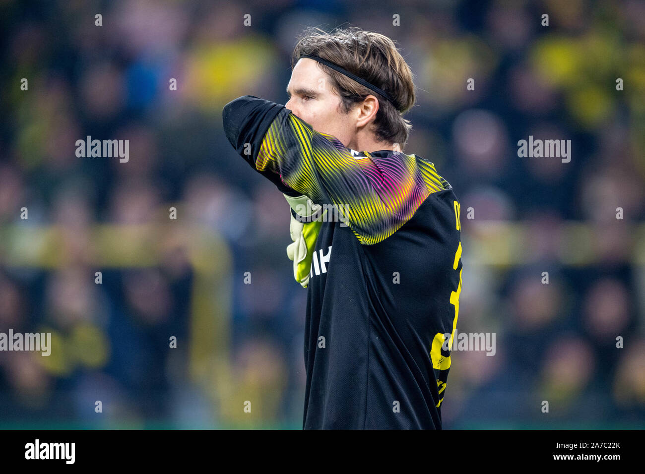 goalkeeper Marvin HITZ (DO) holds his arm in front of his mouth ...
