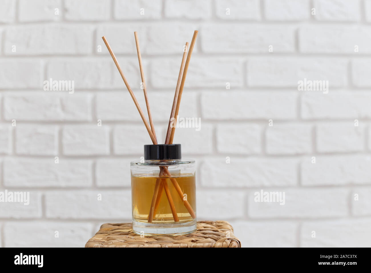 Home fragrance with bamboo sticks. Indoor Stock Photo - Alamy