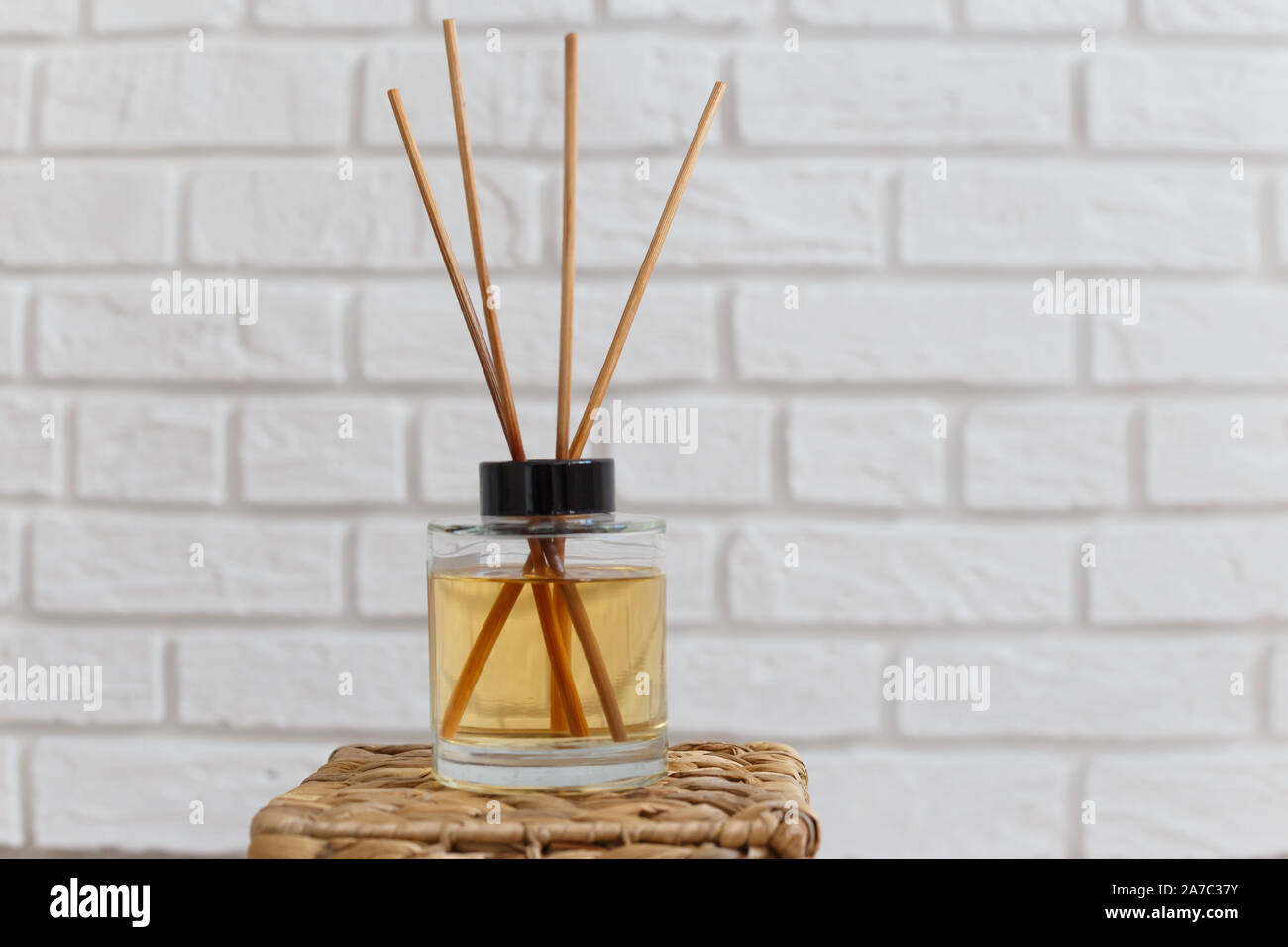 Home fragrance with bamboo sticks. Indoor Stock Photo - Alamy