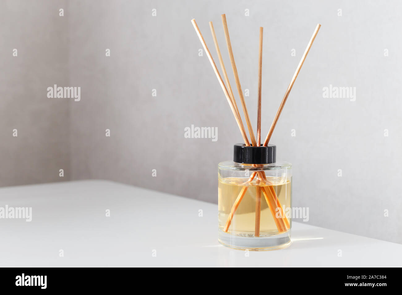 Home fragrance with bamboo sticks. Indoor Stock Photo - Alamy