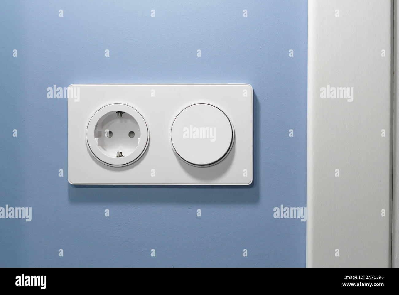 Socket and switch in one common frame Stock Photo - Alamy