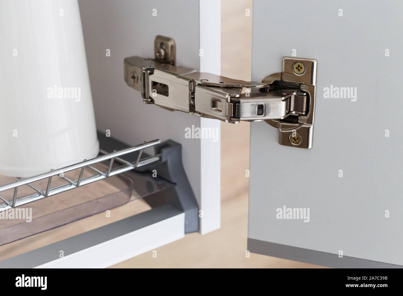 Door hinge of cabinet for drying dishes. Wide angle hinge Stock Photo ...