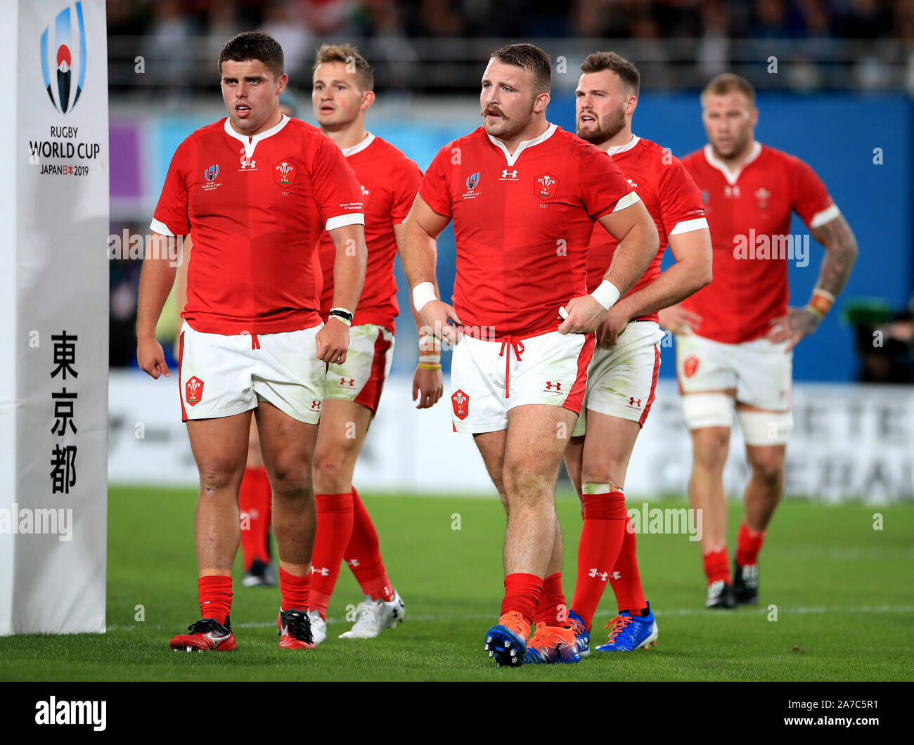 Wales' Dillon Lewis (centre) appears dejected after New Zealand's Ryan ...
