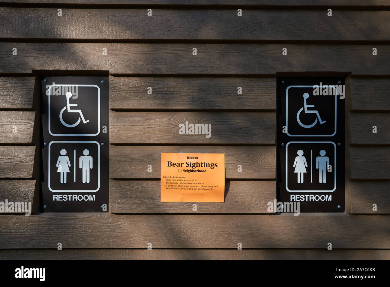 Orange warning sign on the restroom at Moose Creek Campground: Recent ...