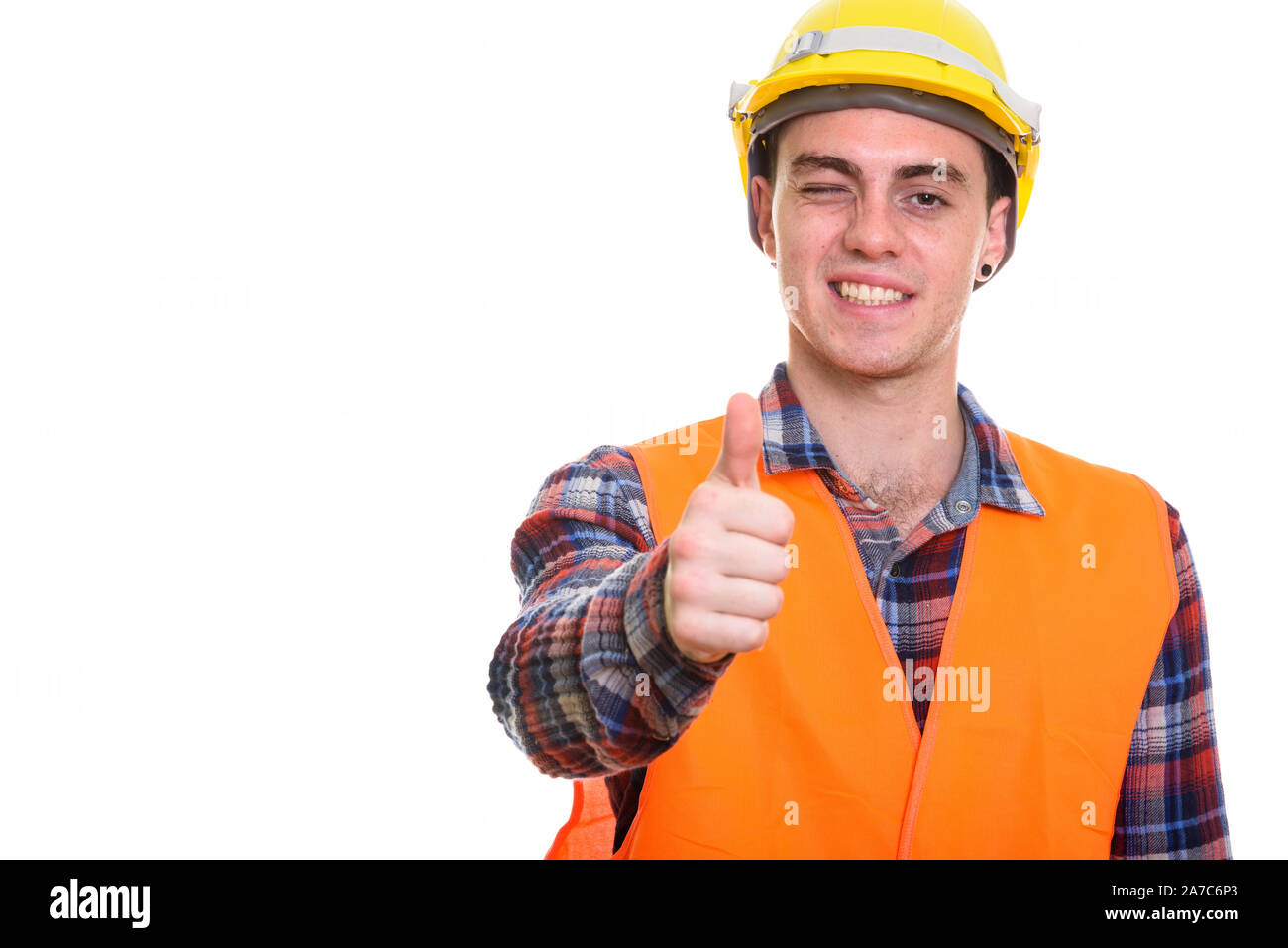 Portrait of young handsome man construction worker giving thumbs up ...