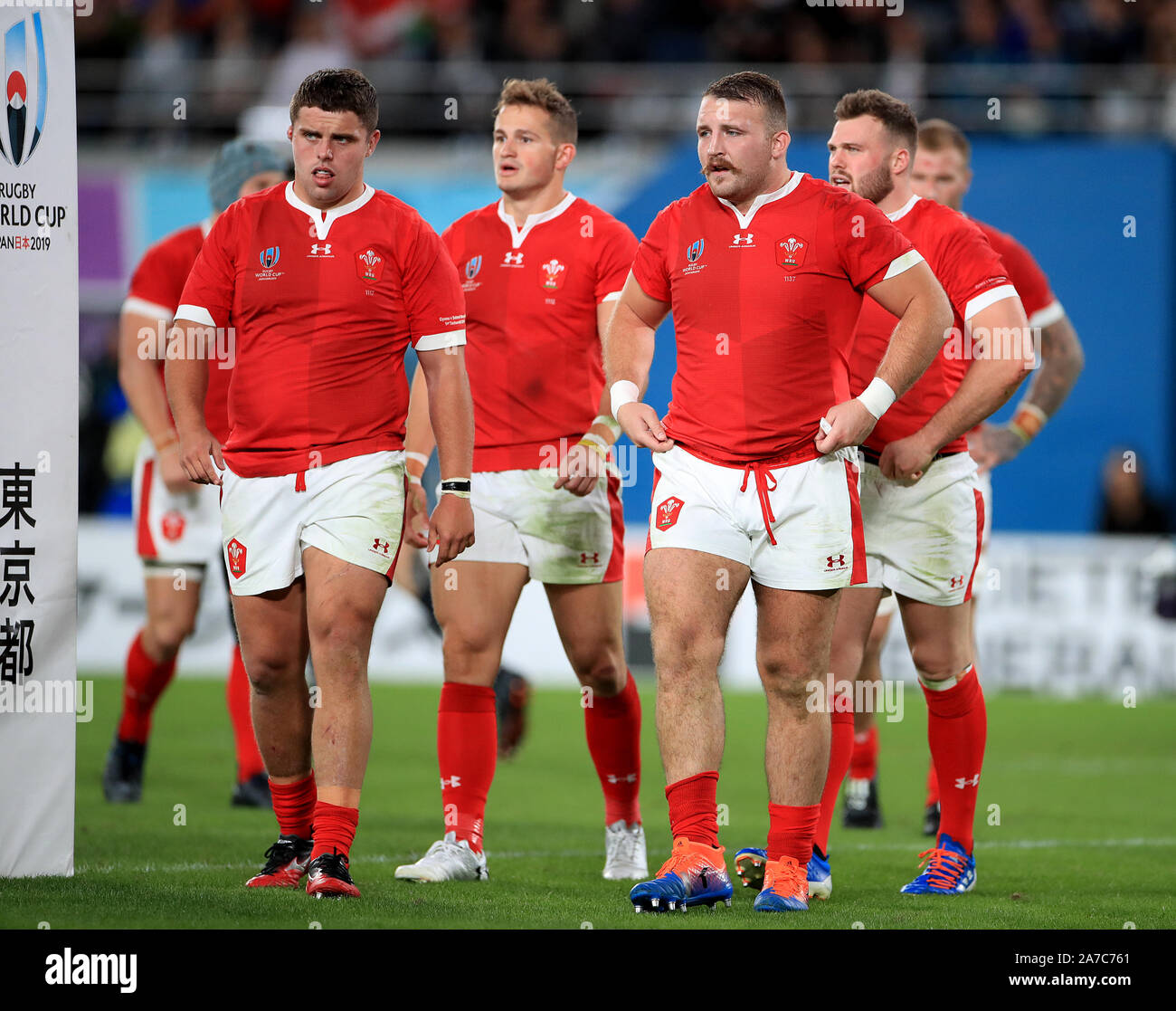 Wales' Dillon Lewis (centre) appears dejected after New Zealand's Ryan ...