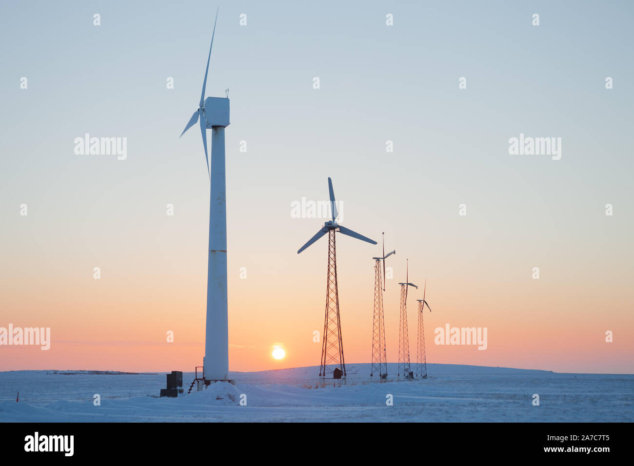 Wind powered generators in the arctic winter at sunset. Kotzebue ...