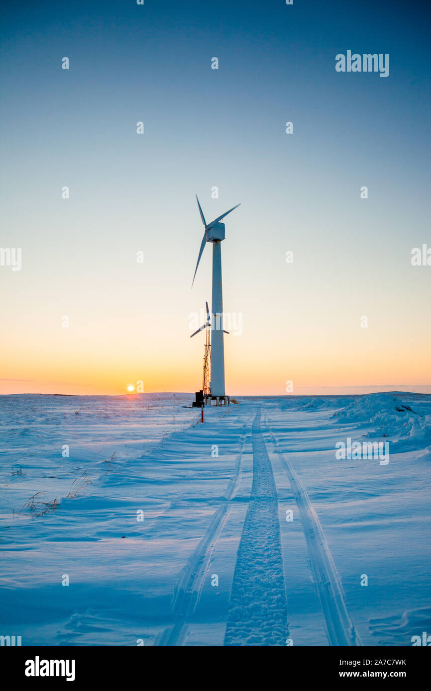 Wind powered generators in the arctic winter at sunset. Kotzebue ...