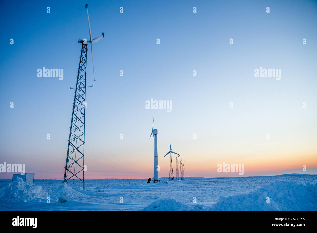 Wind powered generators in the arctic winter at sunset. Kotzebue ...