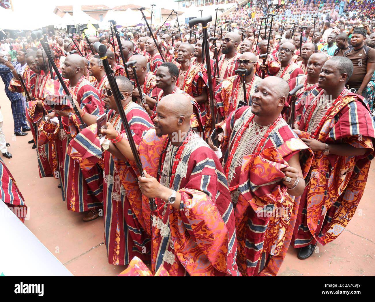 Men in their cultural attire removing their cap to pay homage to the ...