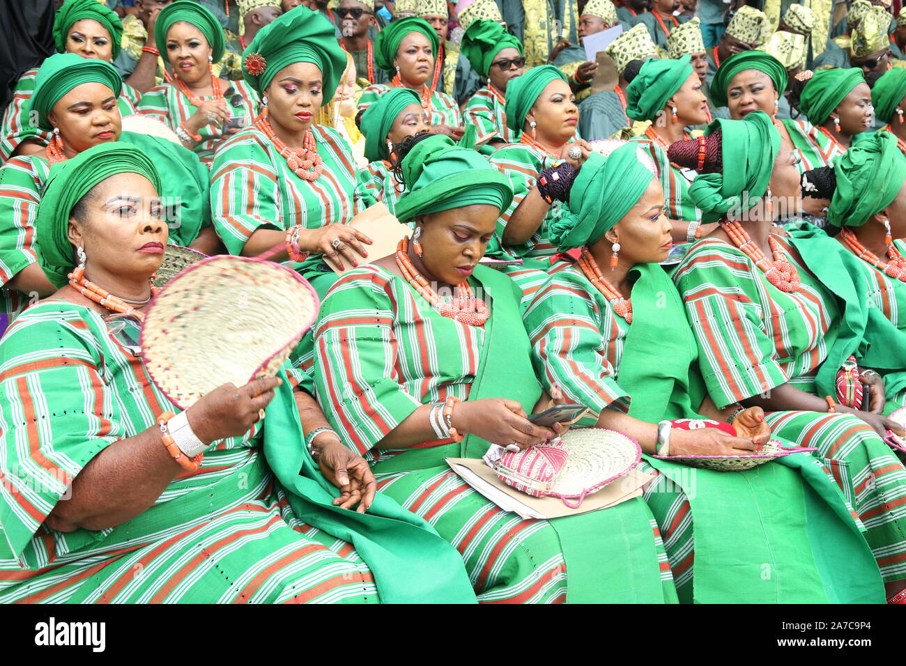 African Women In Their Traditional Attire Sitting At The Kings