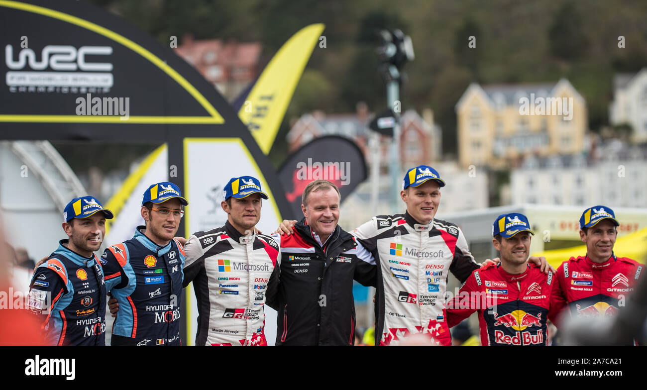 Drivers from the top teams celebrate on the podium at the closing ...