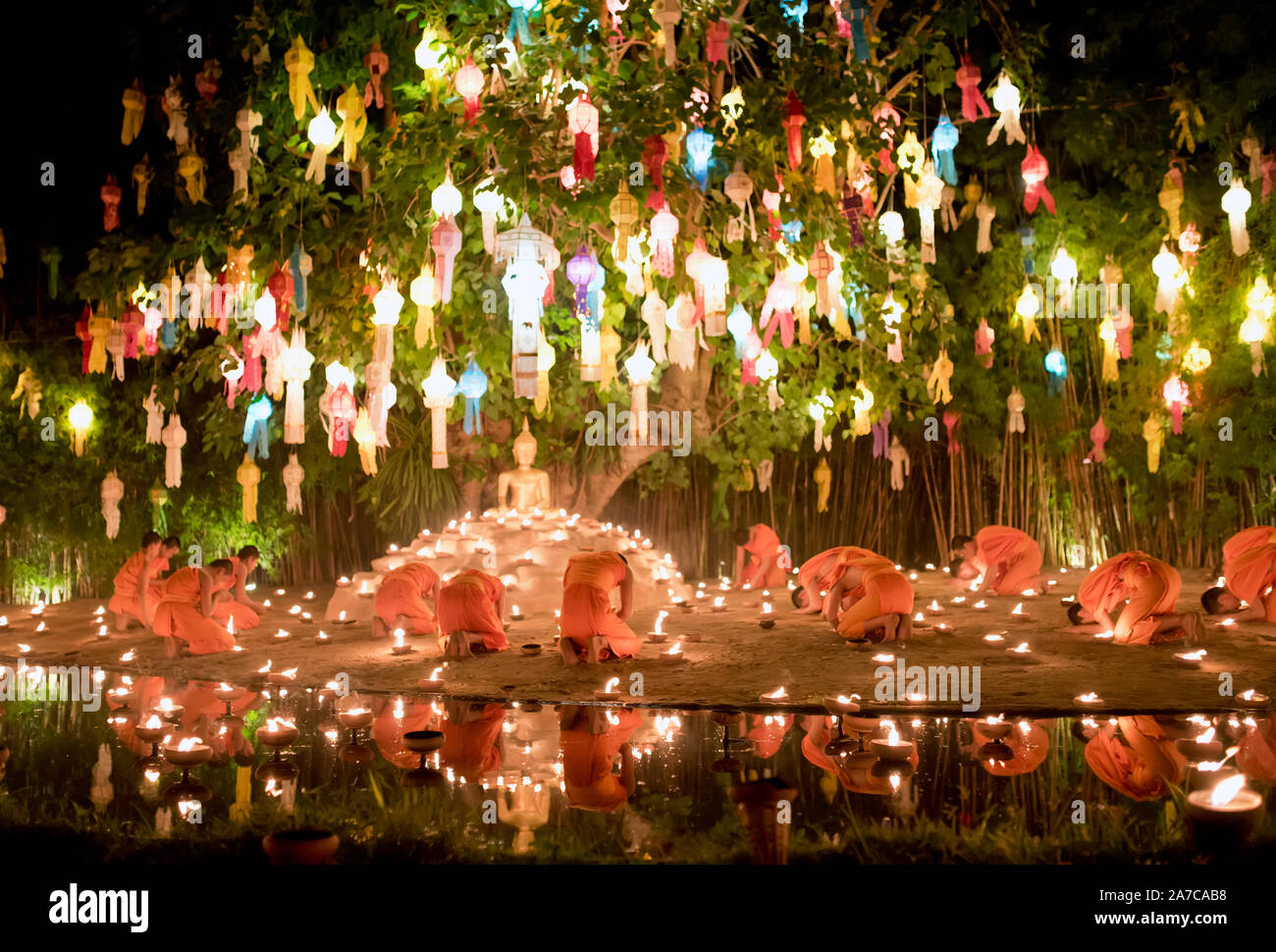 Groups of young Buddhist monks launch sky lanterns at the Yee Peng ...