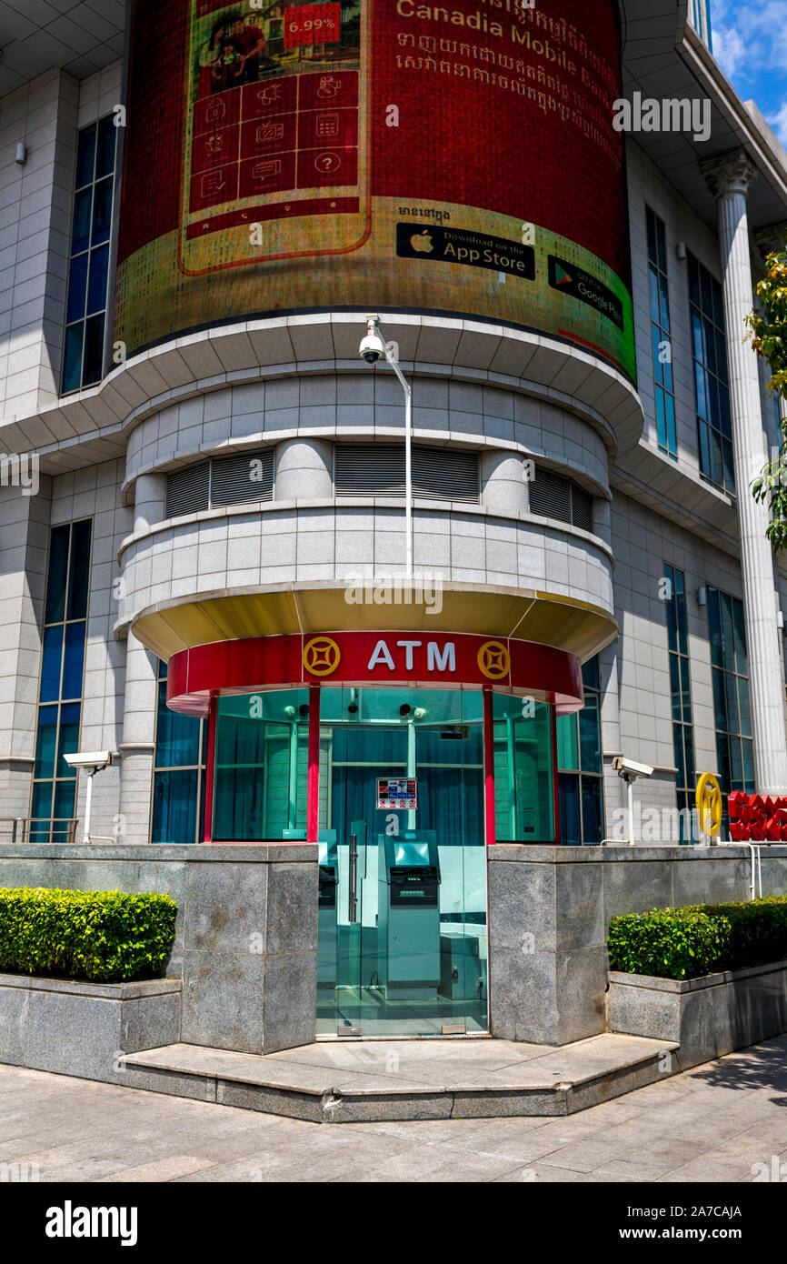 A large digital electronic billboard advertises banking services above ...
