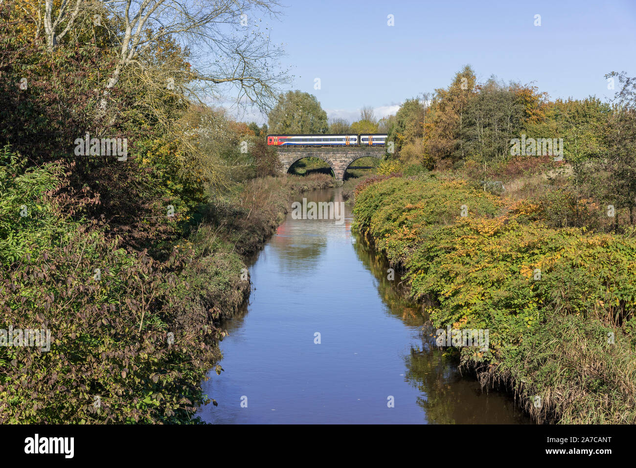 An EMR Regional train crossing the Sankey Brook in Sankey Valley Park ...
