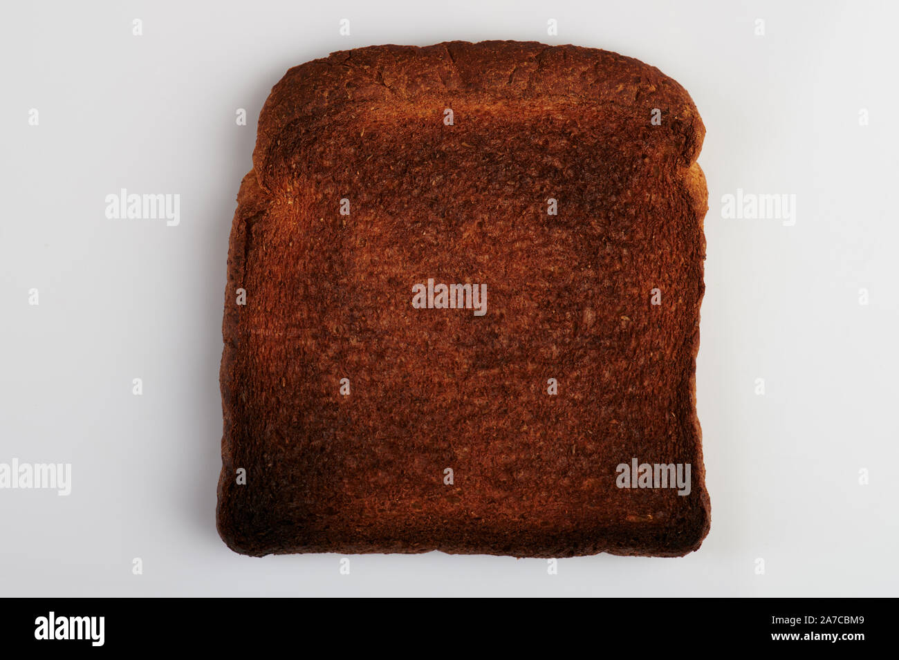 One slice of burn toast bread isolated on white background Stock Photo ...