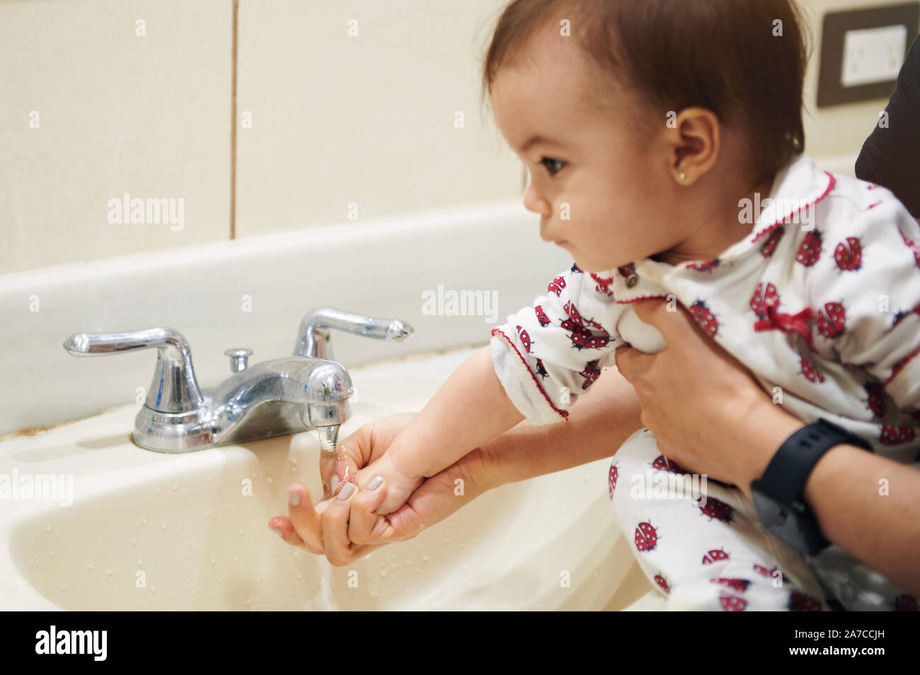 Child washing hands bathroom hi-res stock photography and images - Alamy