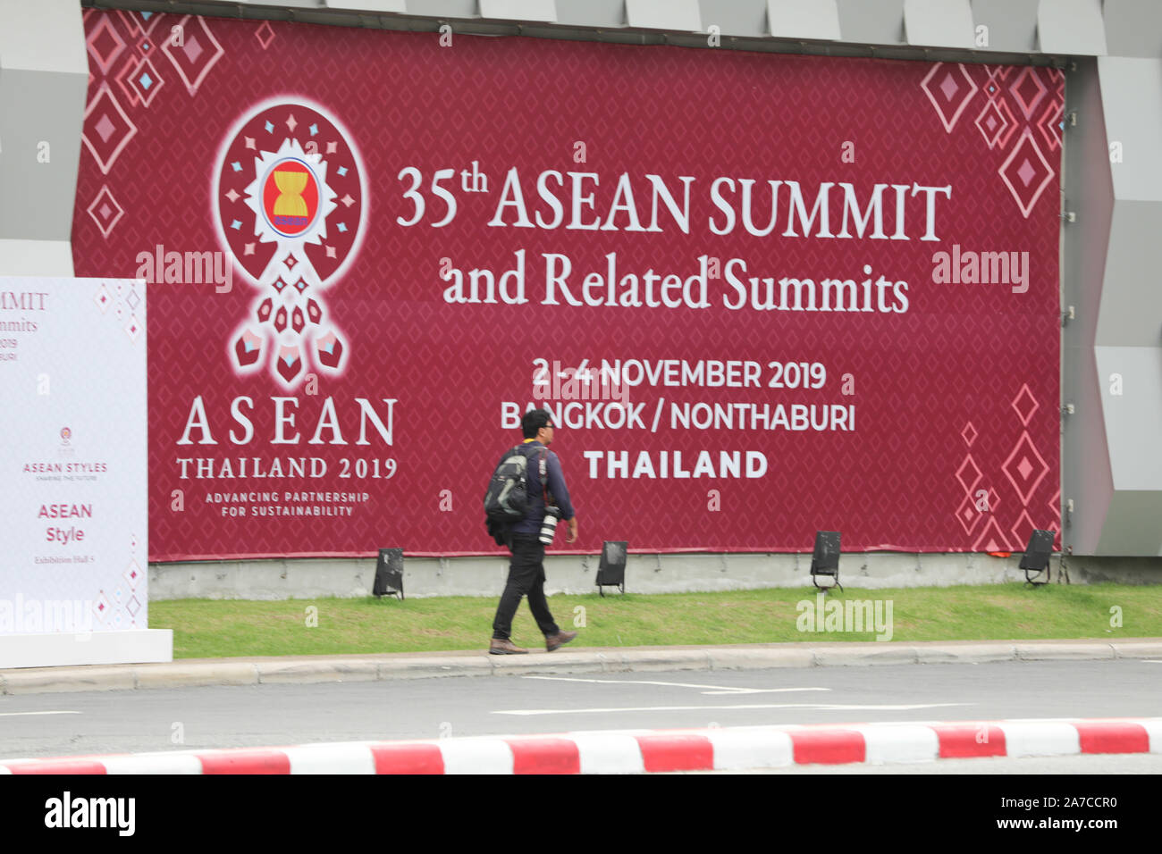 Bangkok, Thailand. 1st Nov, 2019. A man passes by a poster of the 35th ...