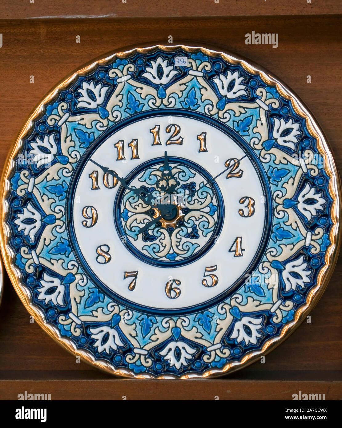 Ceramic clock marking the time Stock Photo - Alamy