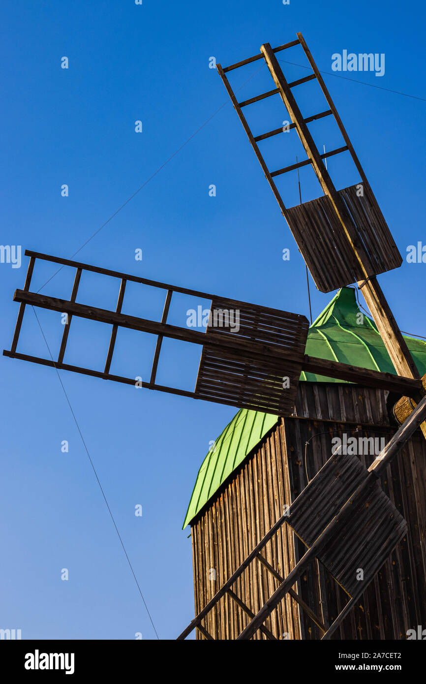 Traditional Ukrainian Windmill on blue sky background in Pirogovo ...