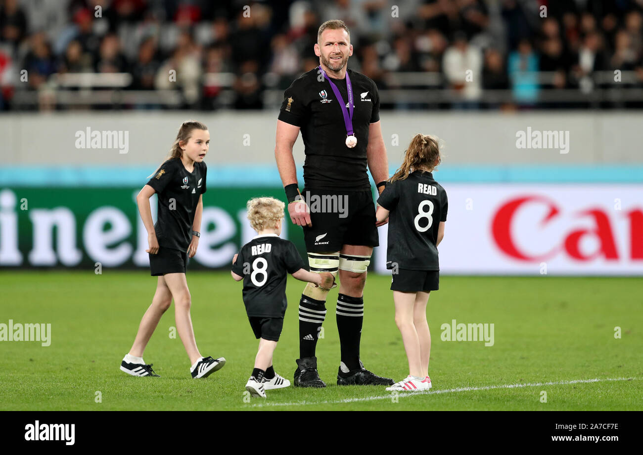 New Zealand's Kieran Read celebrates on the pitch with his family after ...