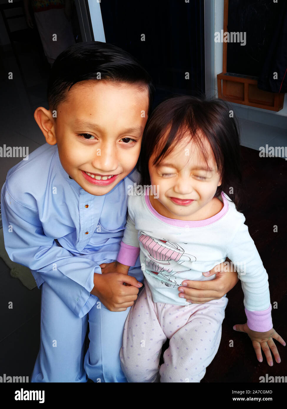 Portrait of asian brother and toddler sister. Family love bonding ...