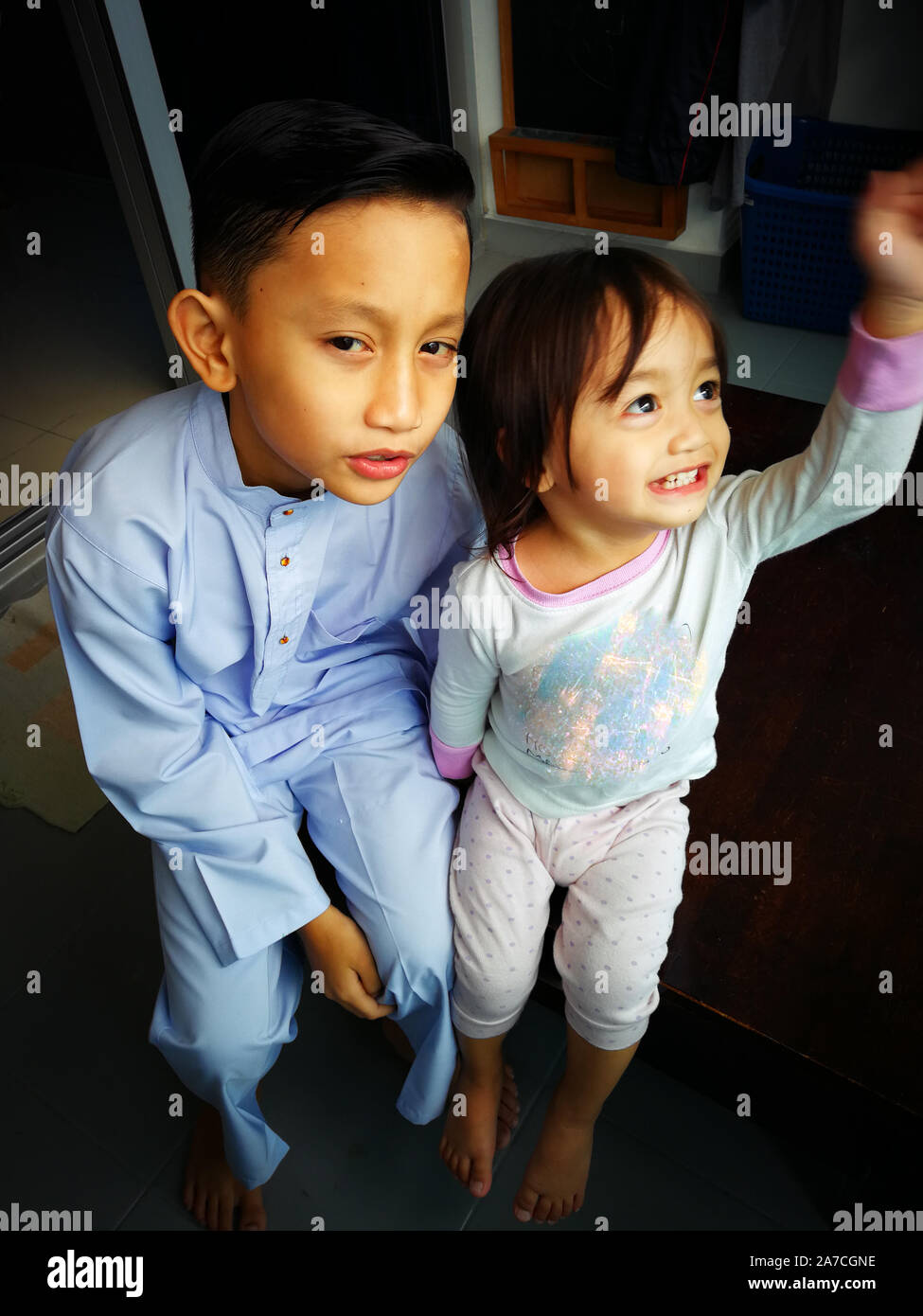 Portrait of asian brother and toddler sister. Family love bonding ...