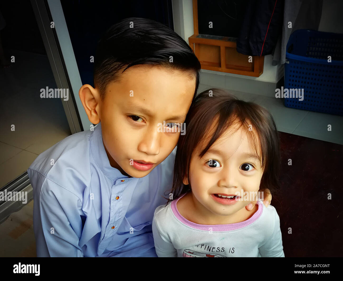 Portrait of asian brother and toddler sister. Family love bonding ...