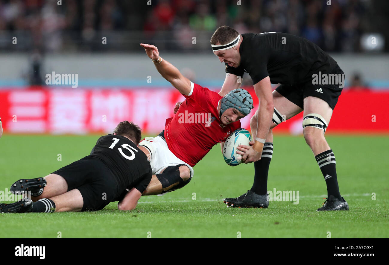 Wales' Jonathan Davies is tackled by New Zealand's Beauden Barrett ...