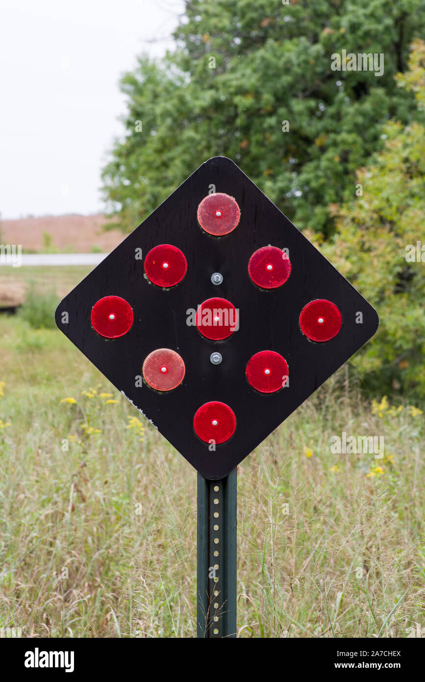 Black sign with red reflectors Stock Photo - Alamy