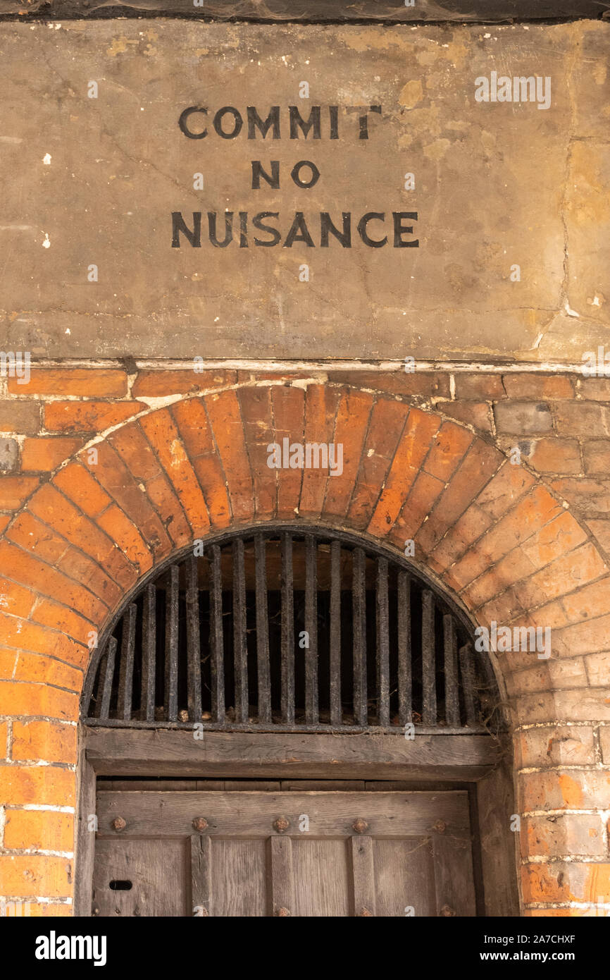 Notice reading "commit no nuisance" above the old town lock-up inside ...