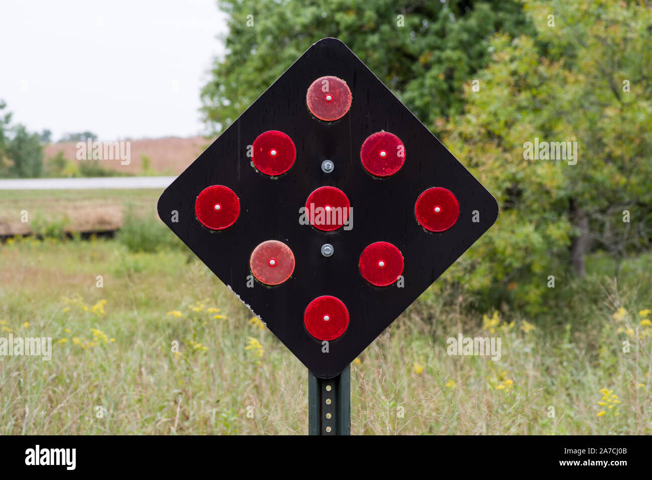 Black sign with red reflectors Stock Photo - Alamy