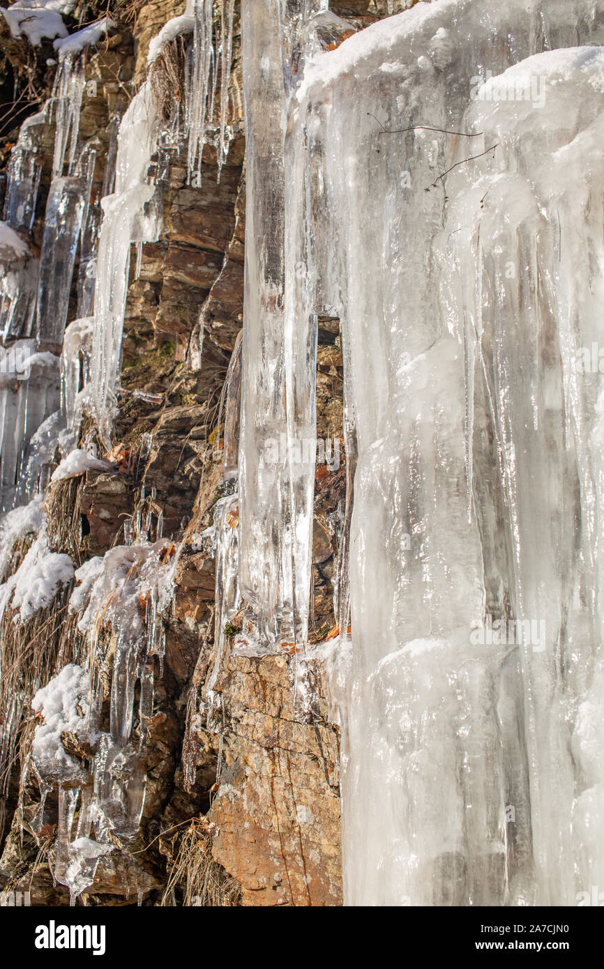 Rocks under ice layers, phantasmagoric ice shapes, frozen leaves, grass ...