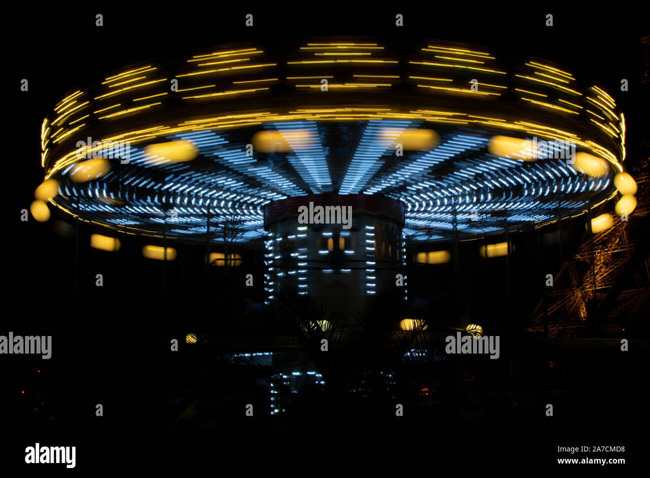 Carousel (merry-go-round) time lapse photo shot in late evening light ...