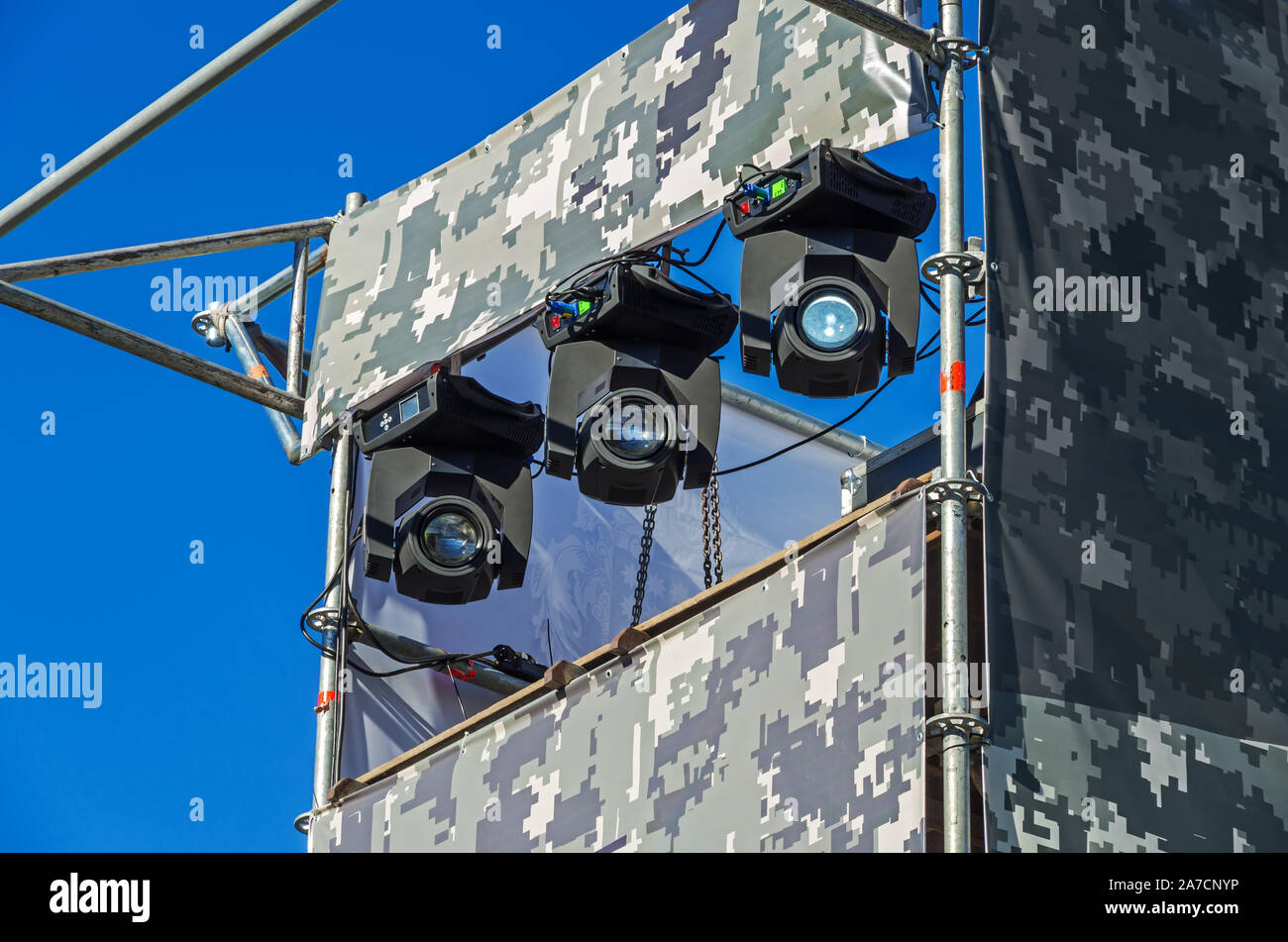 Rotating electrical stage lighting devices located on the street scene ...