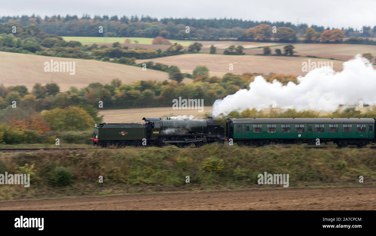 The SR V 'School' class steam locomotive Cheltenham pulls a train along ...