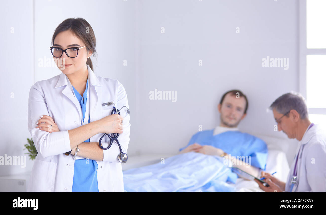 Doctor checking heart beat of patient in bed with stethoscope Stock ...