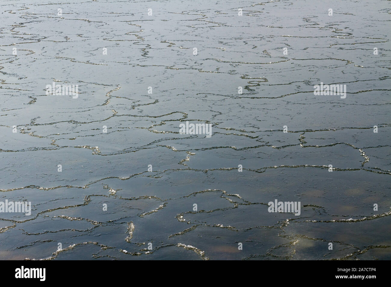 Beautiful and dangerous surface of snow sludge on water Stock Photo - Alamy