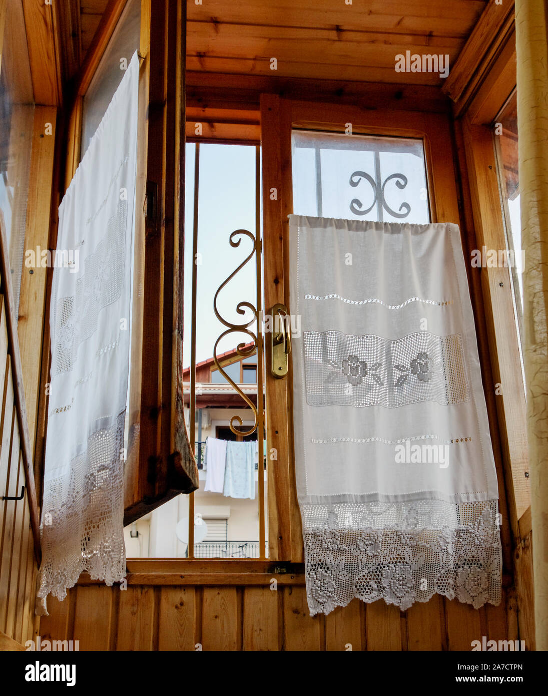 Opened wooden window with white curtains Stock Photo - Alamy