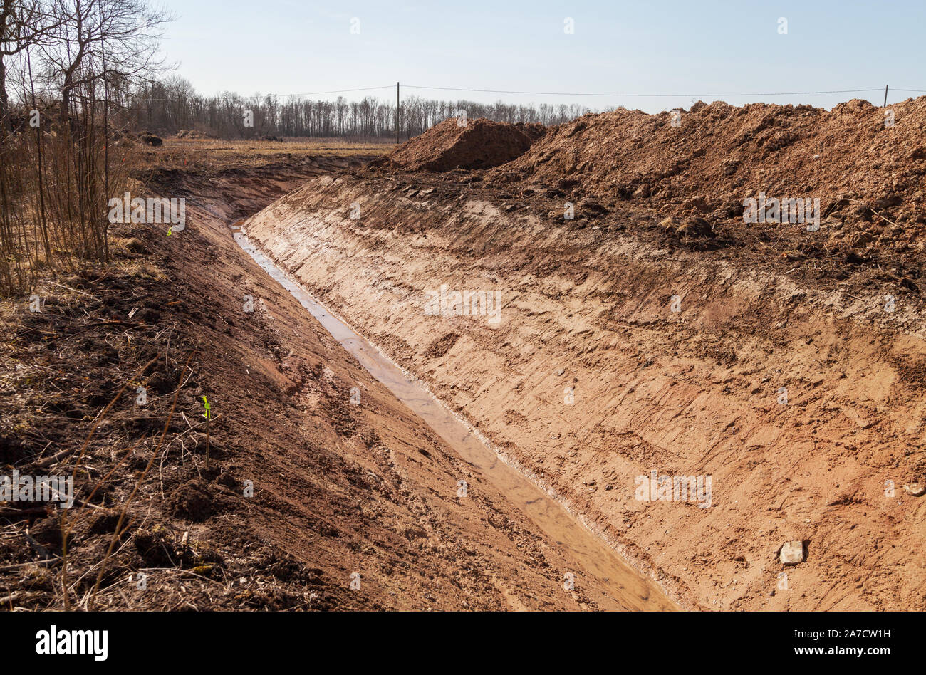 New water catchment canal for agriculture near fields, rural scene ...