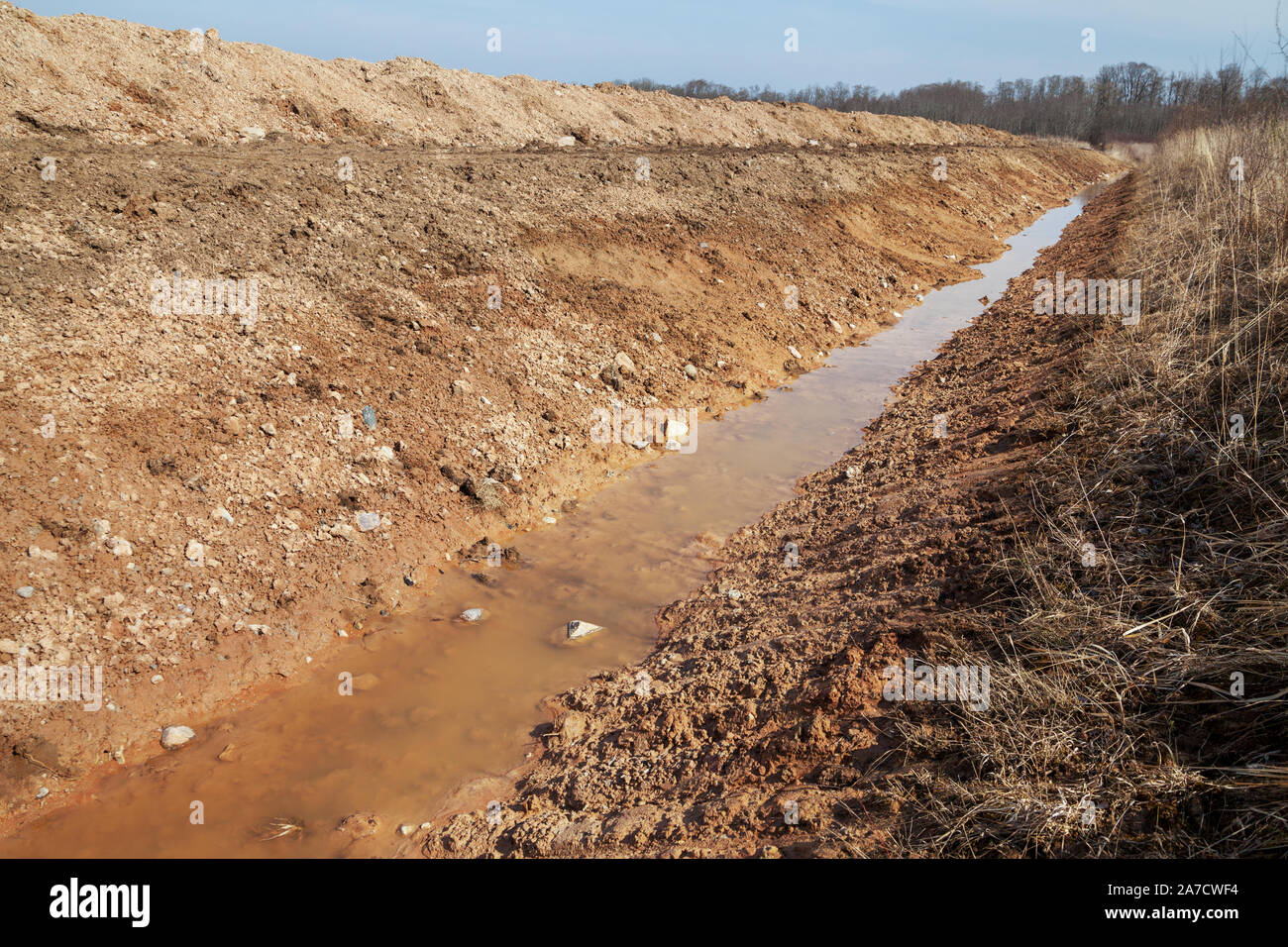 New water catchment canal for agriculture near fields Stock Photo - Alamy