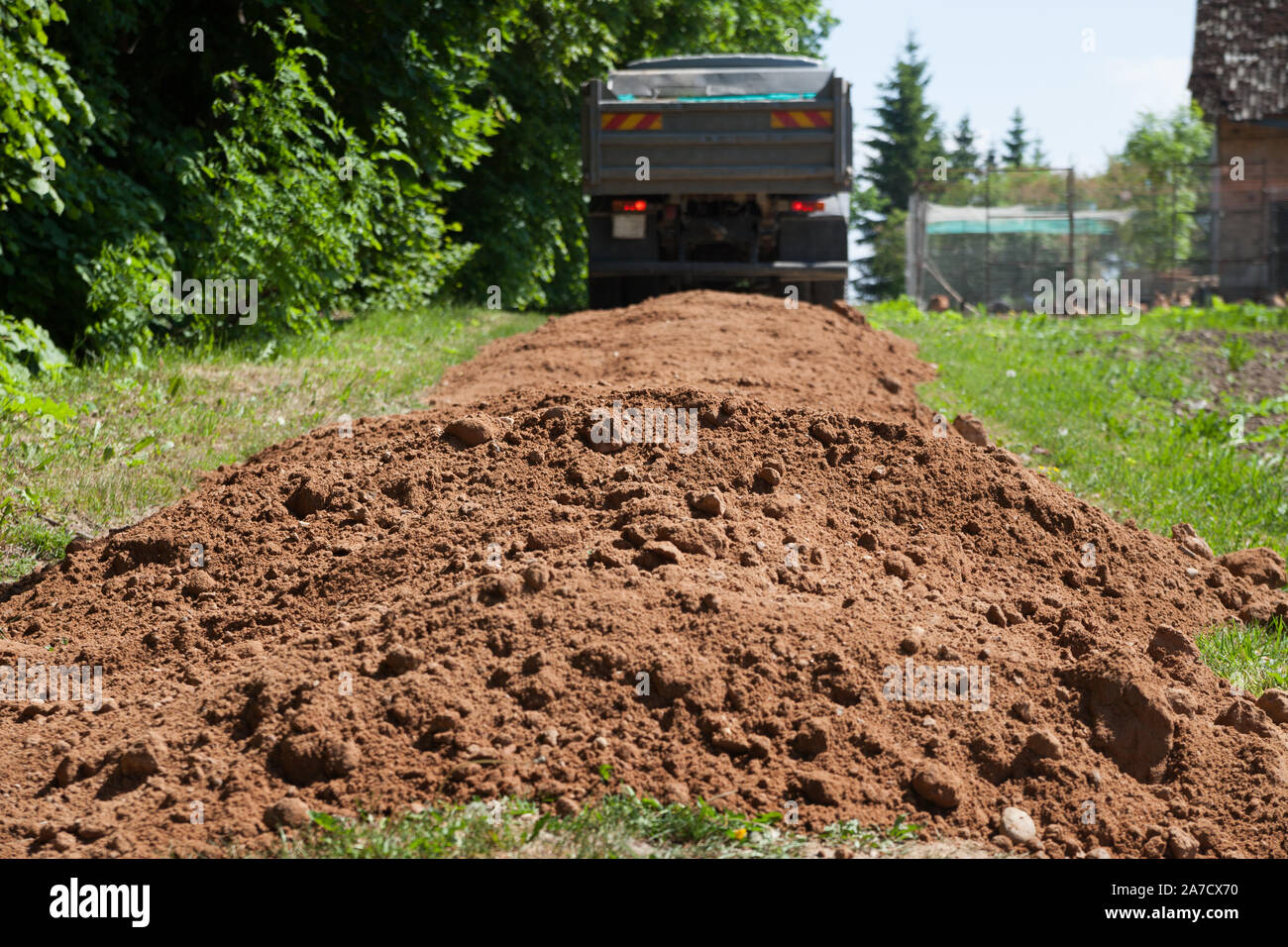 Soil road reconstruction with heavy machinery Stock Photo - Alamy