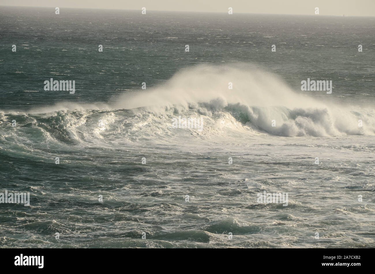 Big Blue Wave Breaks in the Atlantic Ocean Stock Photo - Alamy