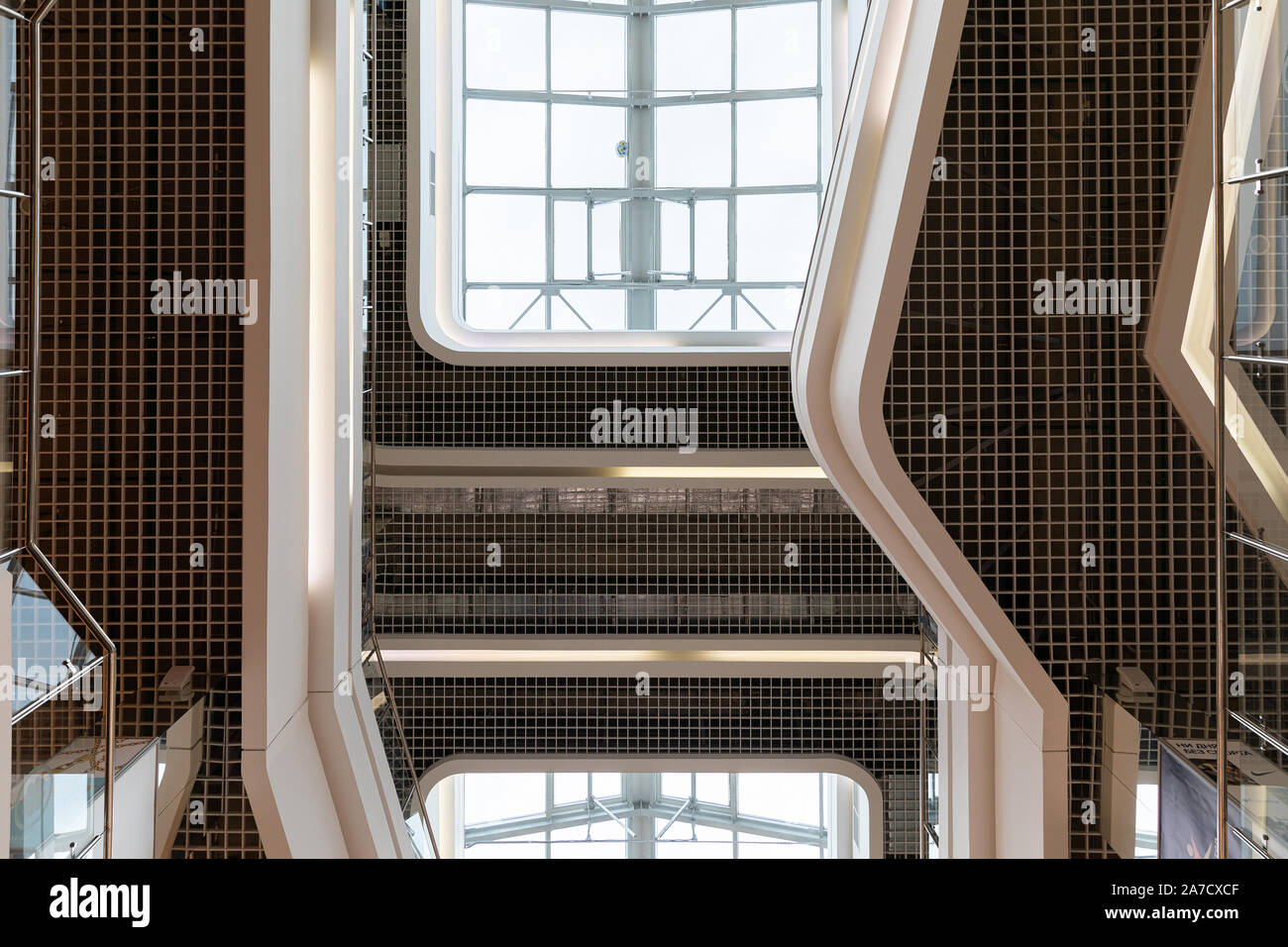 Ground view of shaped geometric ceiling of modern stylish building ...
