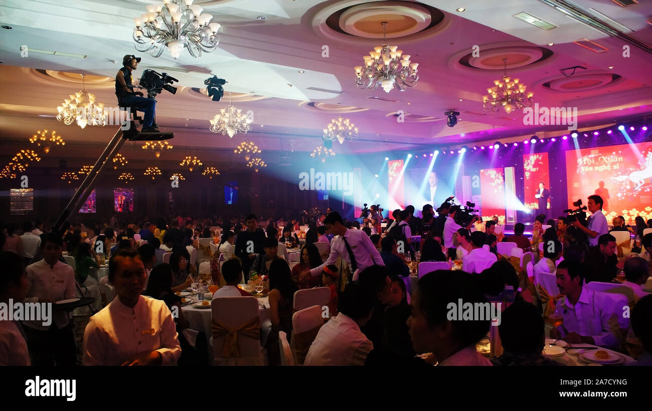 HO CHI MINH CITY, VIET NAM, Cameraman working at night year end party ...