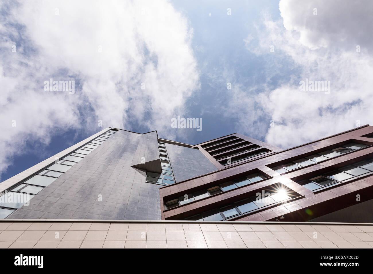 Ground view of high apartment building with modern tiled facade Stock ...
