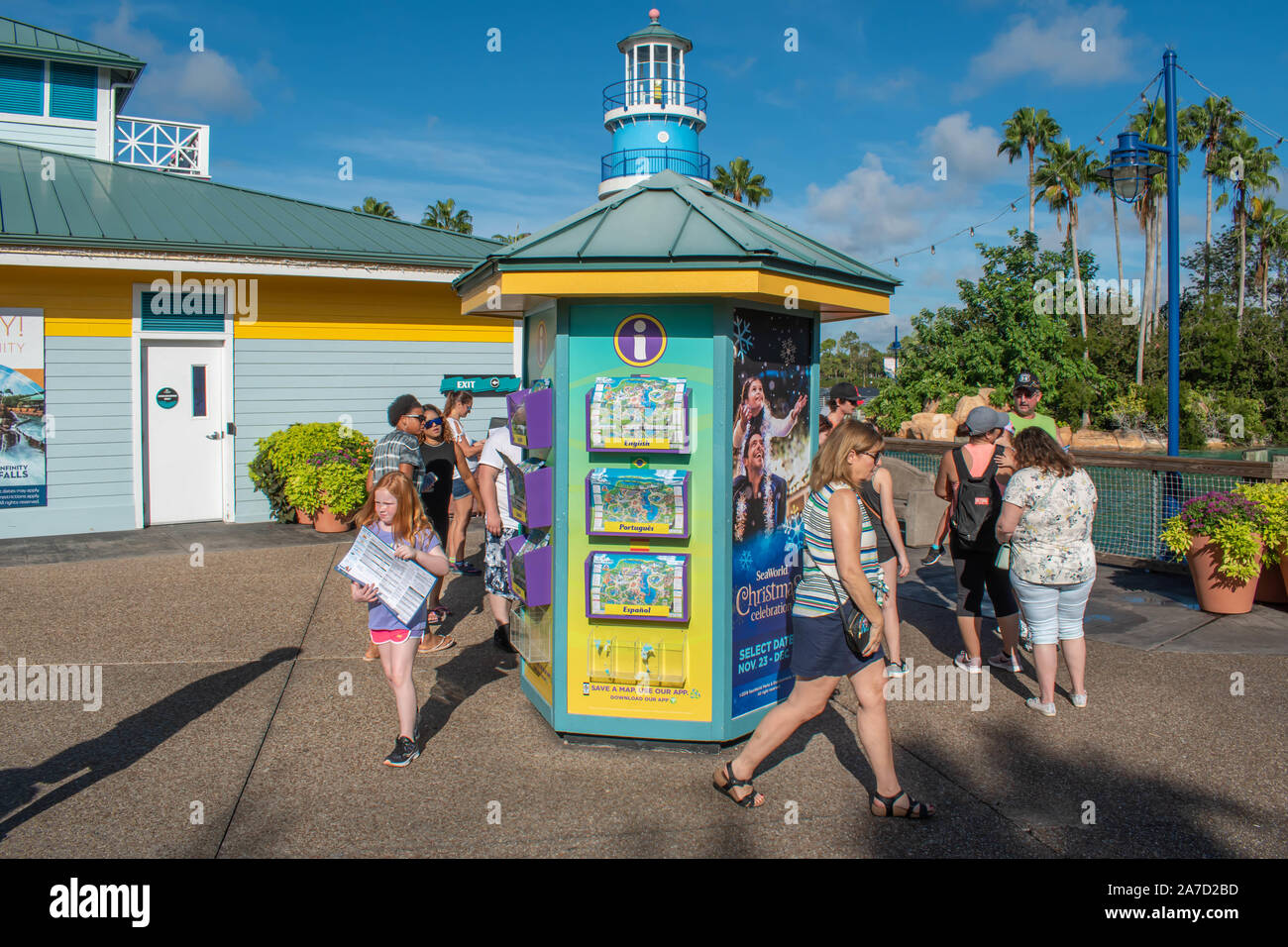 Orlando, Florida. October 29, 2019. People taking maps from the park ...
