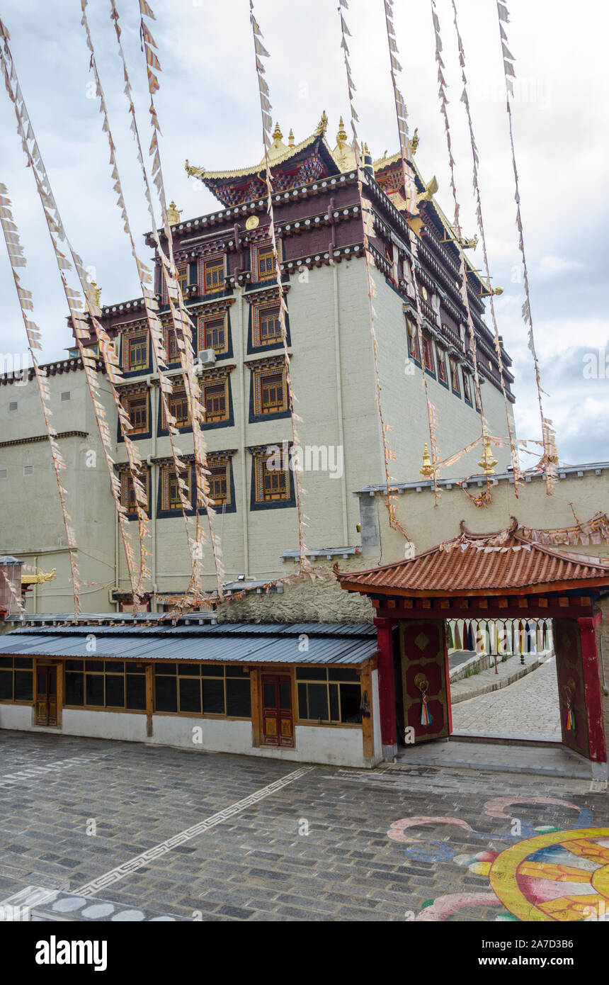 Monks walking outside the The Ganden Sumtseling Monastery, Shangri-La ...