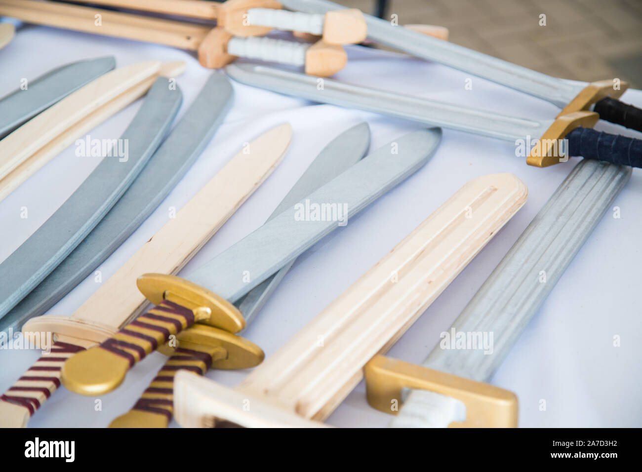 Handmade wooden toy swords Stock Photo - Alamy